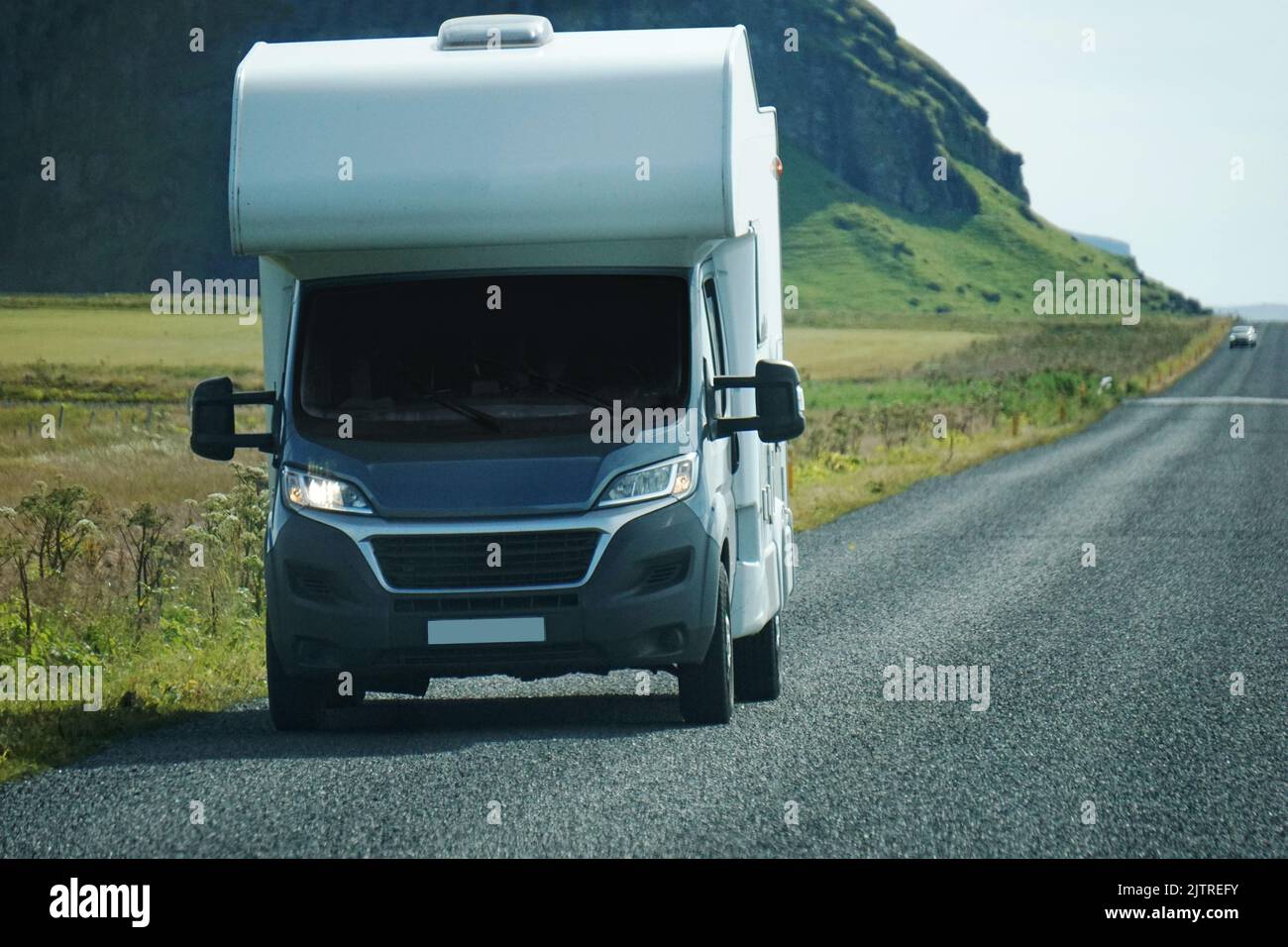 Iceland, Sudurland - August 8th, 2022 - White camper, RV driving on a ...