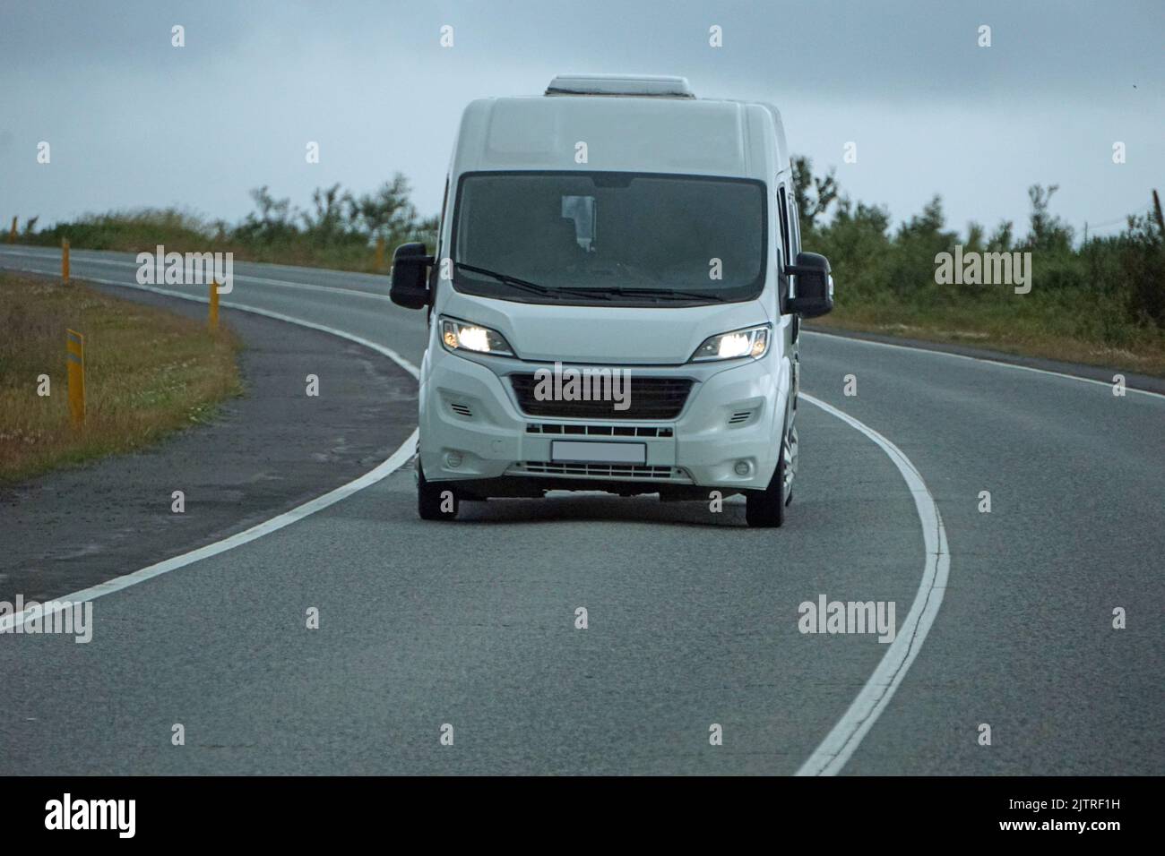 Iceland, Sudurland - August 8th, 2022 - White camper, RV driving on a ...