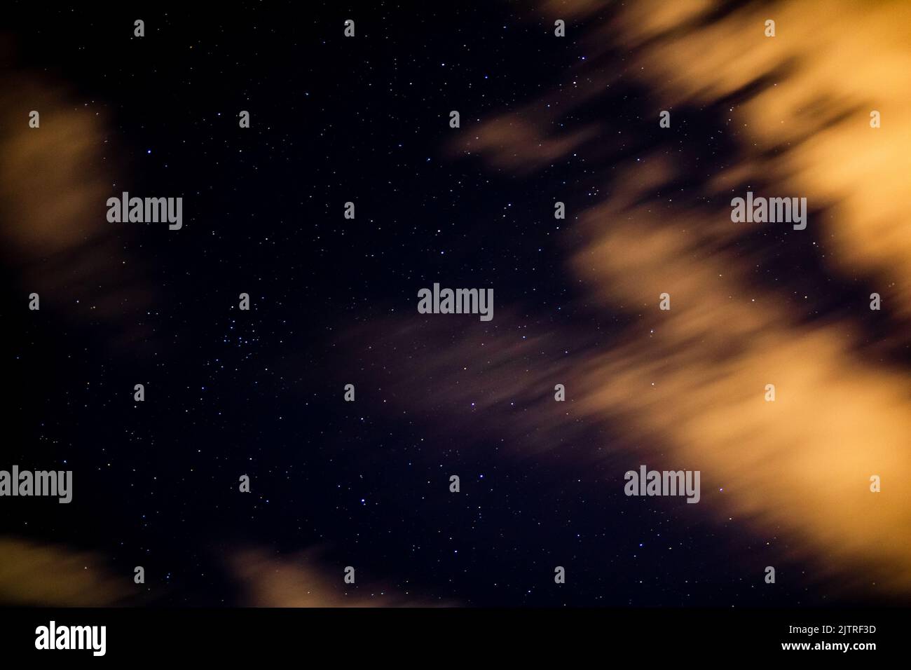 Stars in space, real photography with moving clouds Stock Photo - Alamy