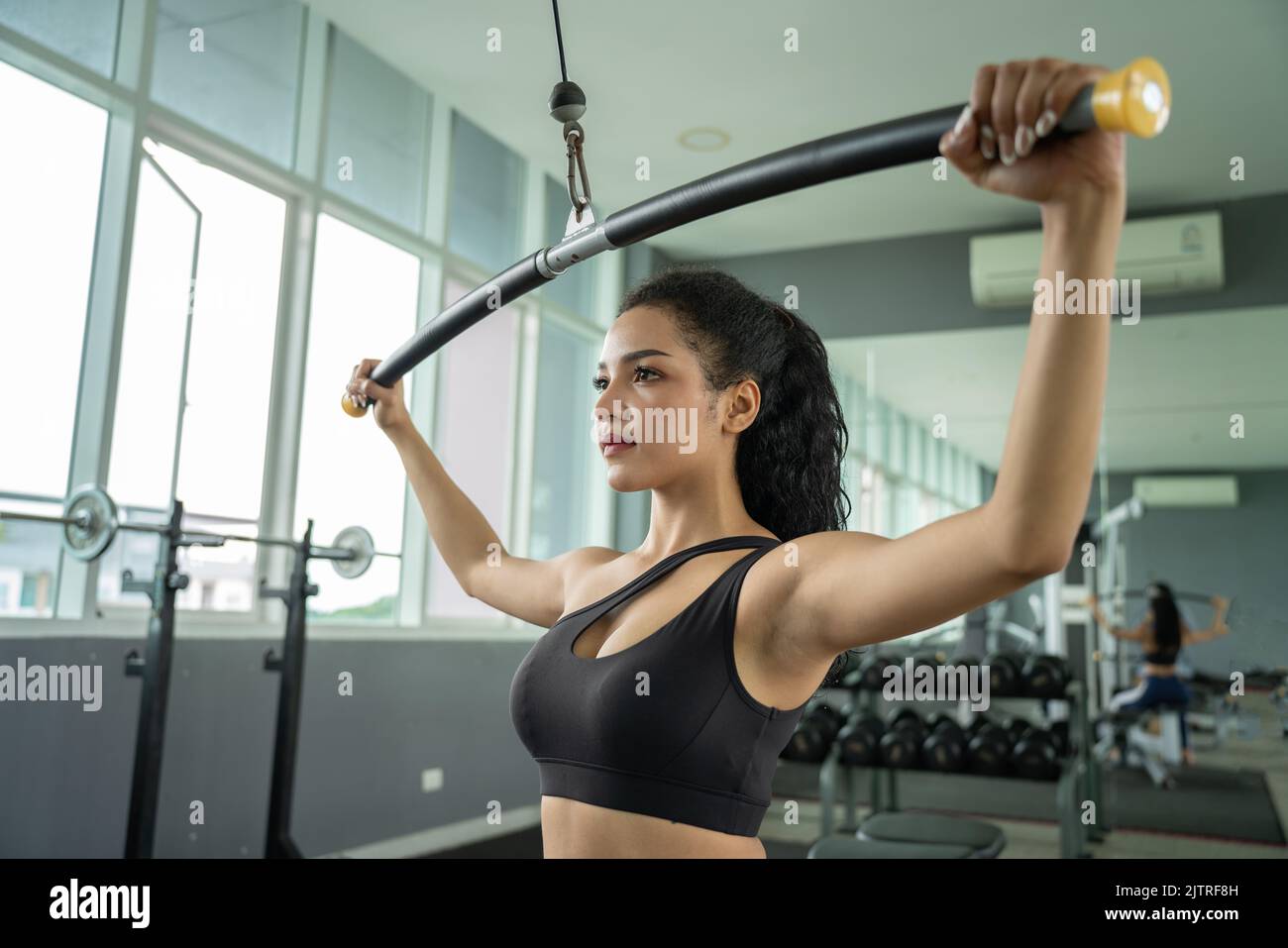 beautiful muscular fit woman exercising building muscles. Muscular ...