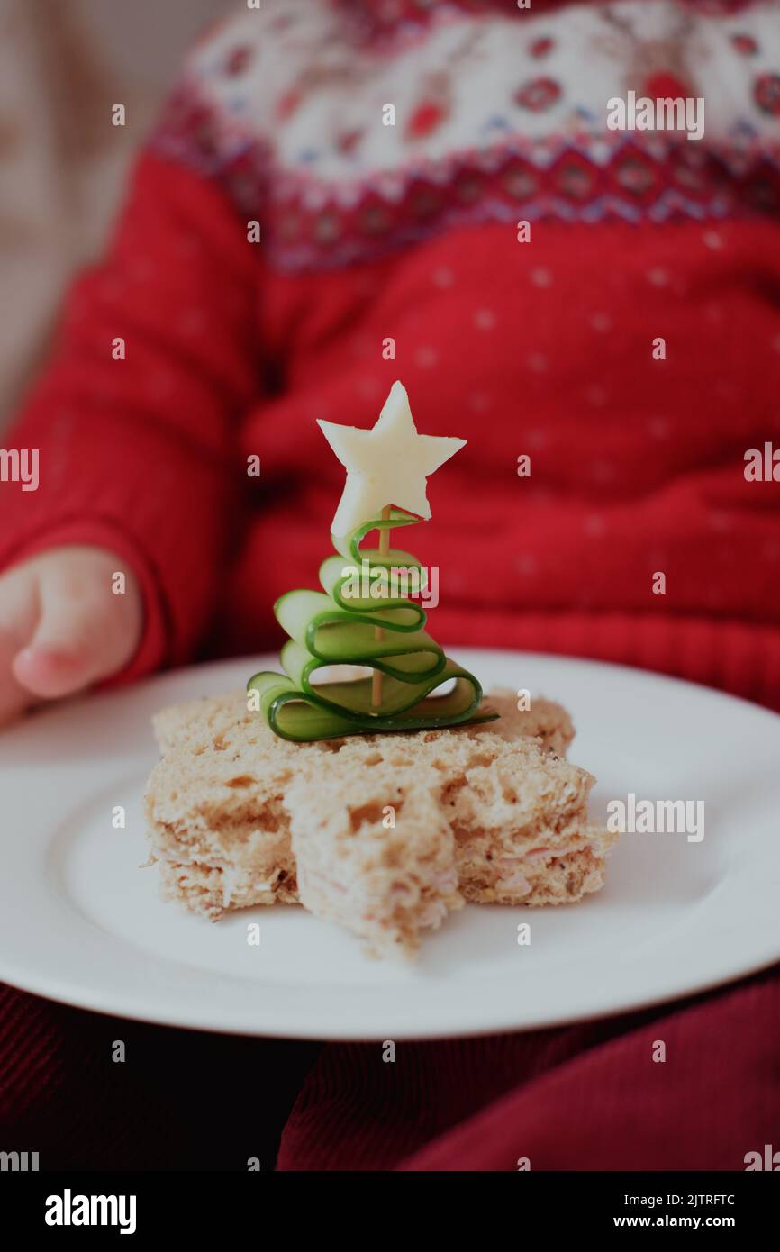 Cucumber shaped to look like a Christmas tree on a cocktail stick ...