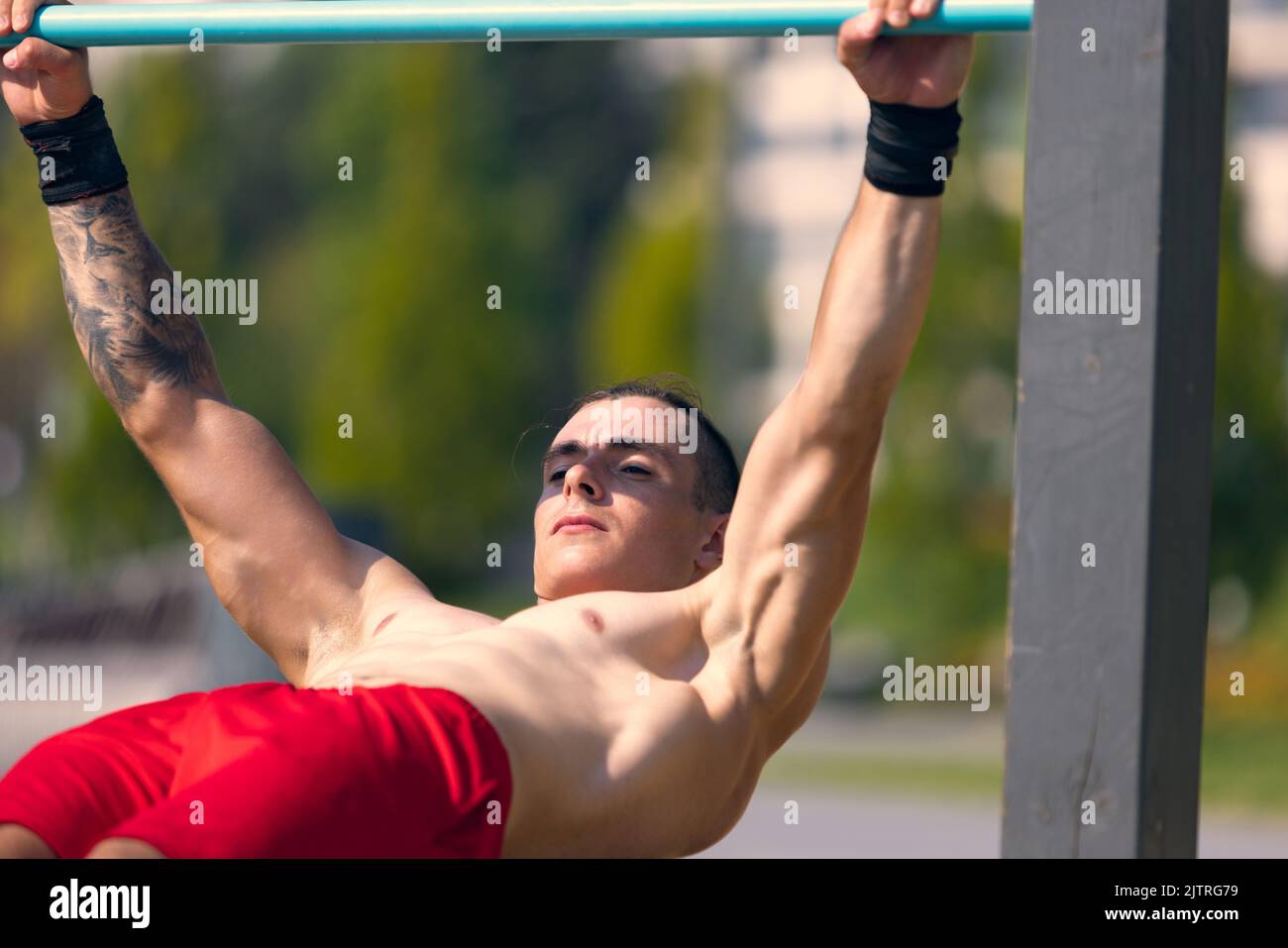 Workout. Strong muscular man, student training, practicing at sport ...