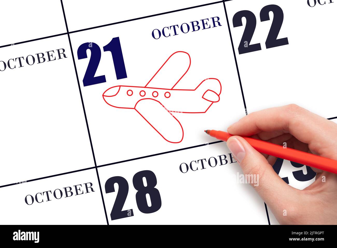21st day of October. A hand drawing outline of airplane on calendar ...