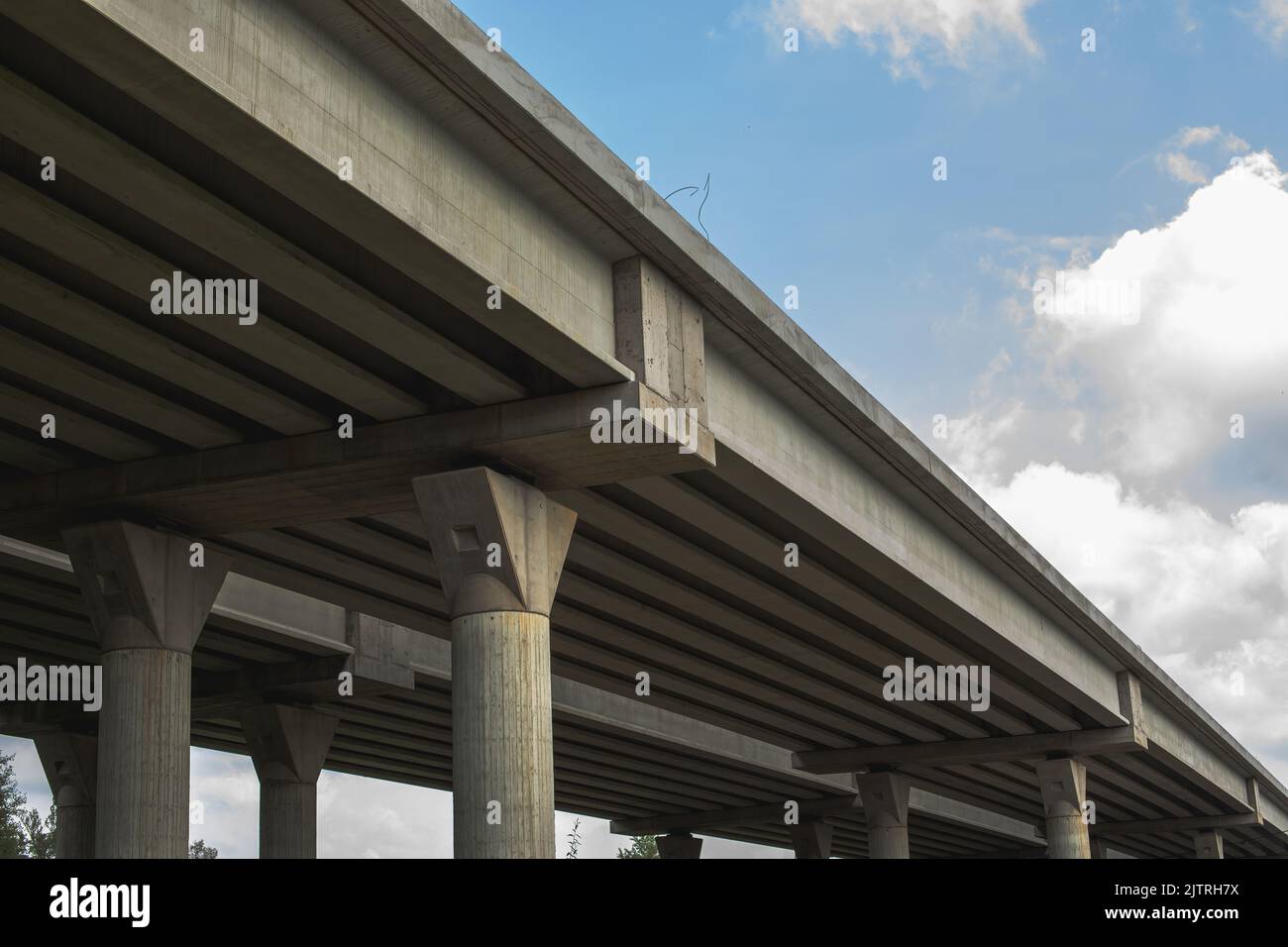 Section of newly constructed elevated highway.Shot against a bright ...
