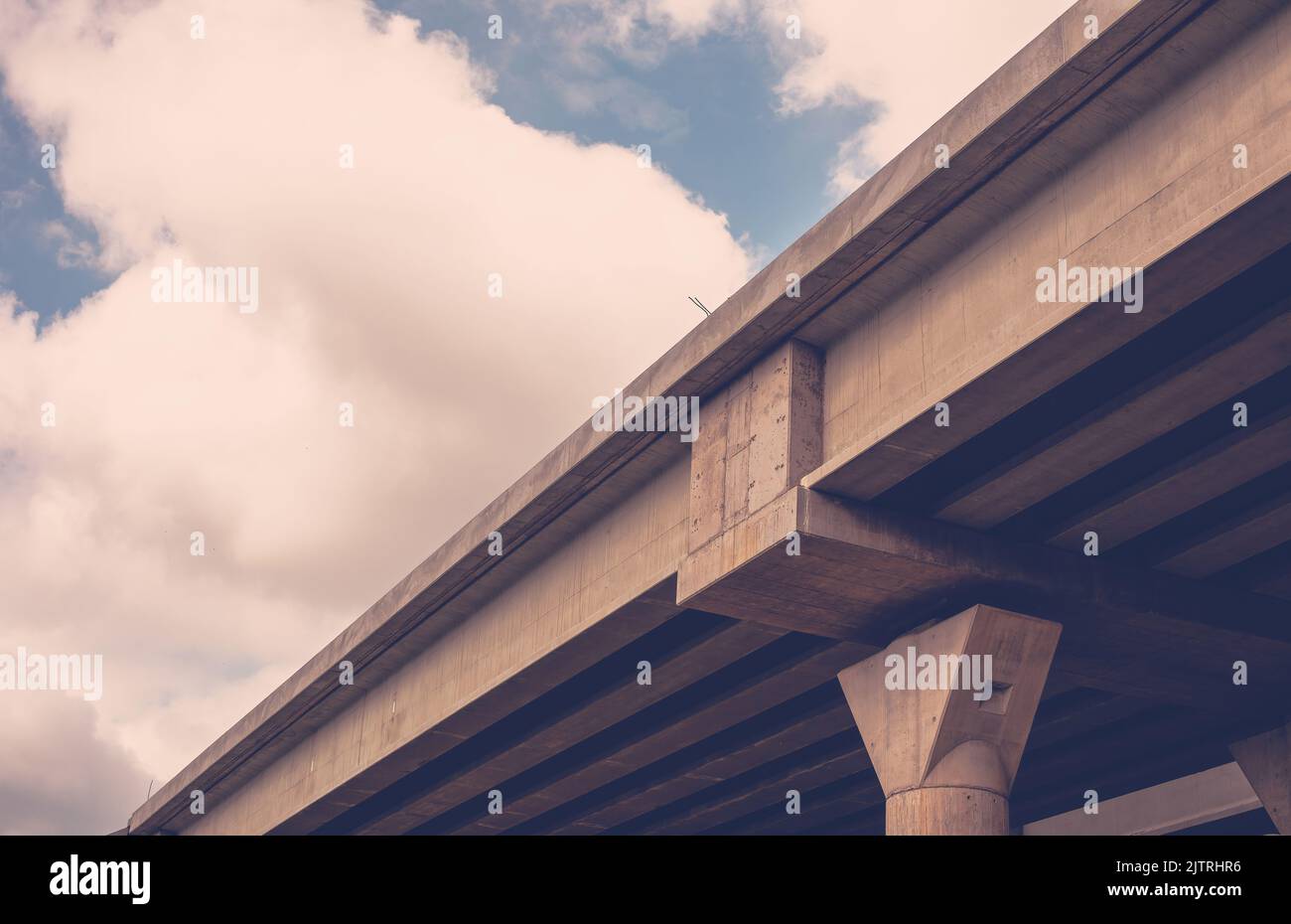 Section of newly constructed elevated highway.Shot against a bright ...