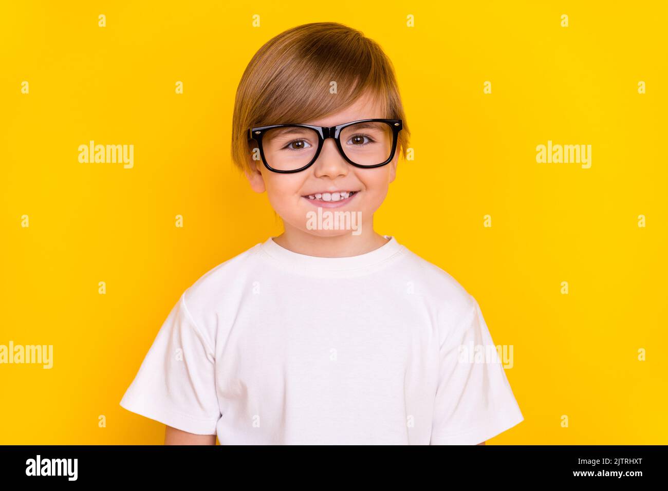 Portrait of handsome trendy cheerful pre-teen boy learner wearing black ...