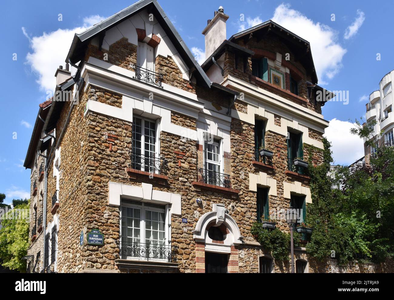 House, or houses, r. Ravignon, Paris, of red-brown rough stone, with ...