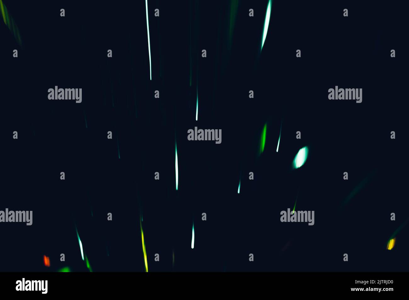 Neon green glowing strokes. Falling firework sparkles. Illuminated ...