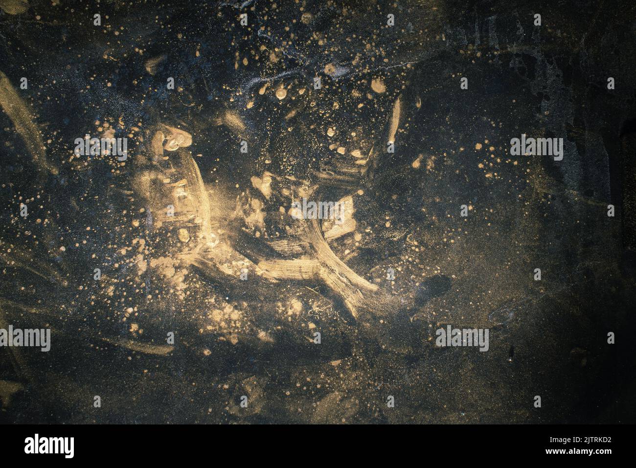 Dark stained abstract background. Rust dust. Golden smeared powder on ...