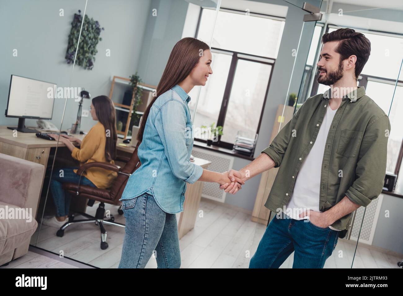 Photo of smiling happy workers successful interview shaking arms future ...