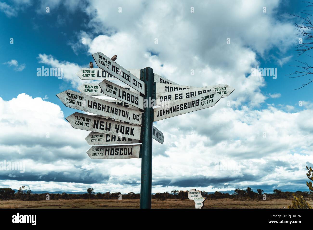 A direction post in Africa with multiple signs Stock Photo - Alamy