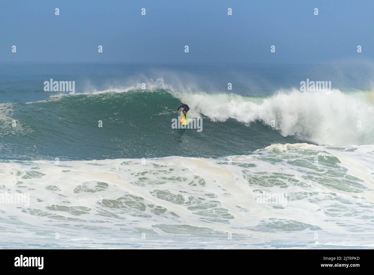 surfer riding a wave at leblon beach in Rio de Janeiro, Brazil - April ...