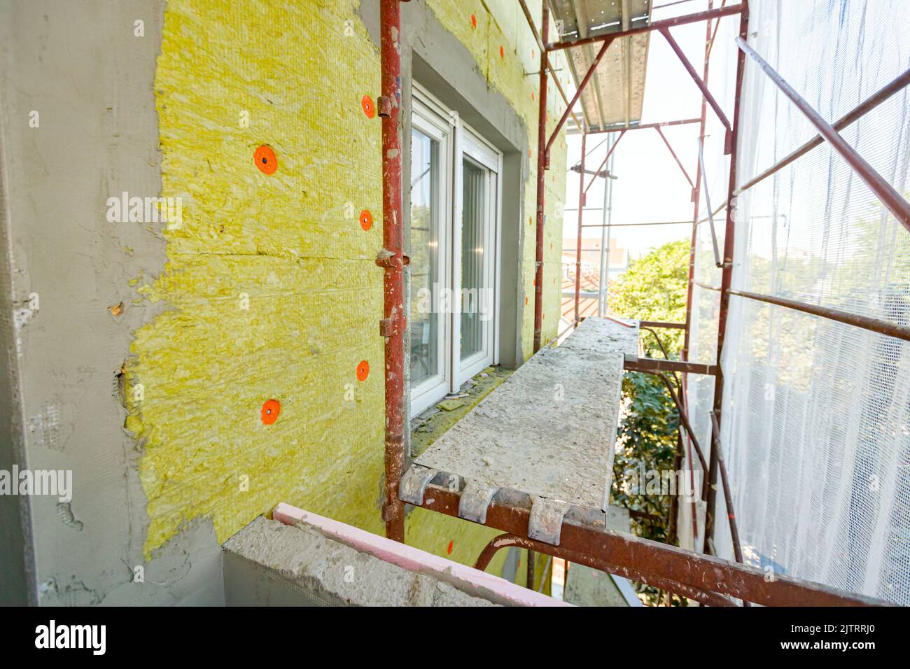 Applied thermal isolation stone wool on the brick wall of residential ...