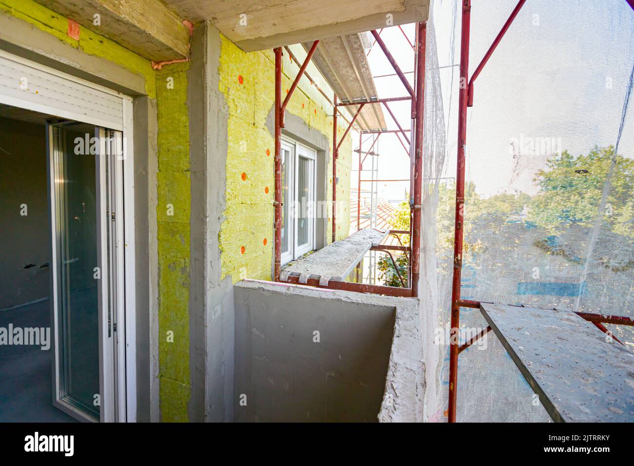 Applied thermal isolation stone wool on the brick wall of residential ...