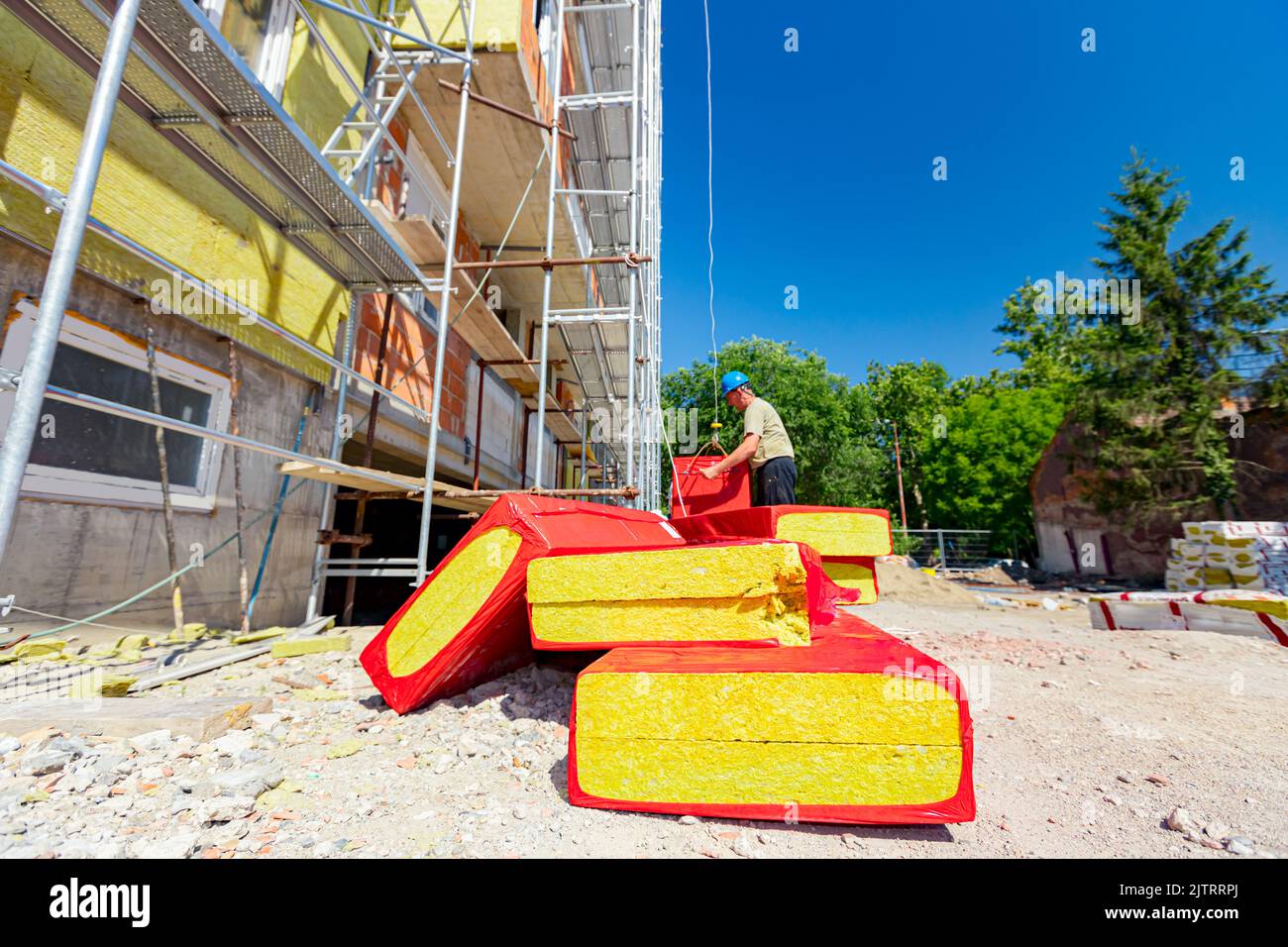 Stack of thermal insulation material is wrapped with cellophane foil ...