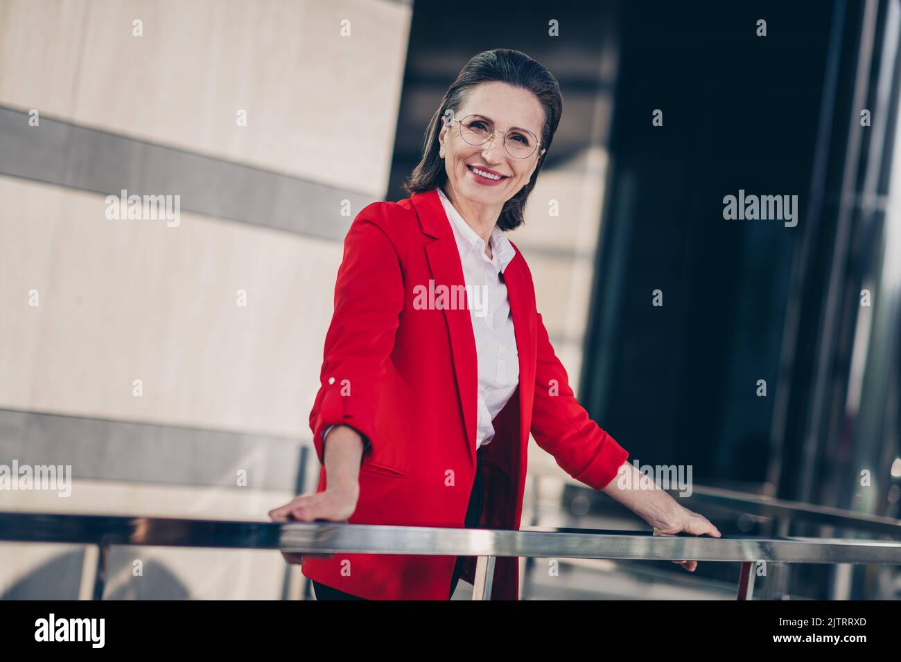 Photo of charming elegant age lady executive lawyer accountant stand ...