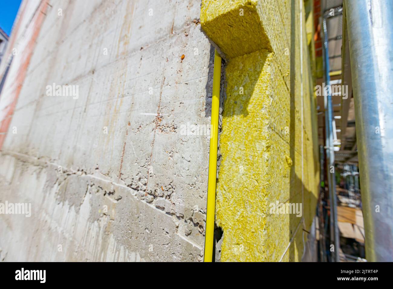 Applying thermal isolation stone wool on the brick wall of residential ...