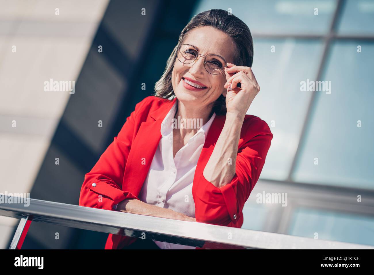 Photo of good mood pretty mature lady ceo wear red jacket hand arm ...