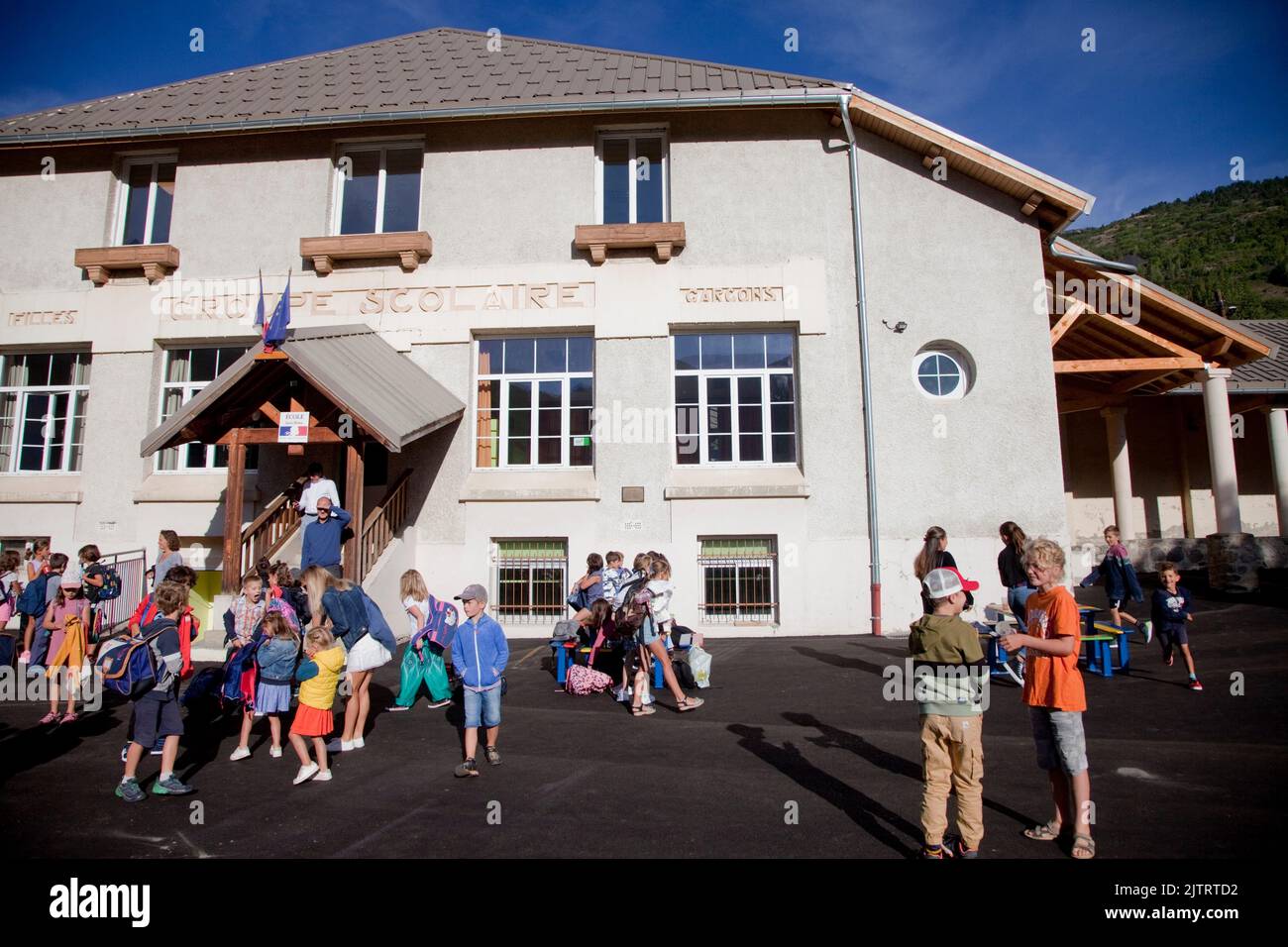 Pupils in the courtyard of their primary schoolyard just before ...