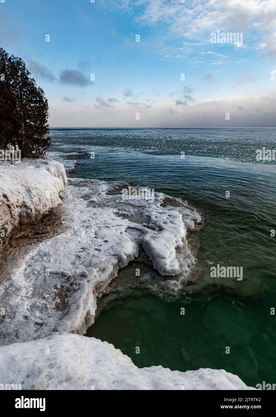 The Lake Michigan shore is dusted with a fresh snow and caked with ice ...