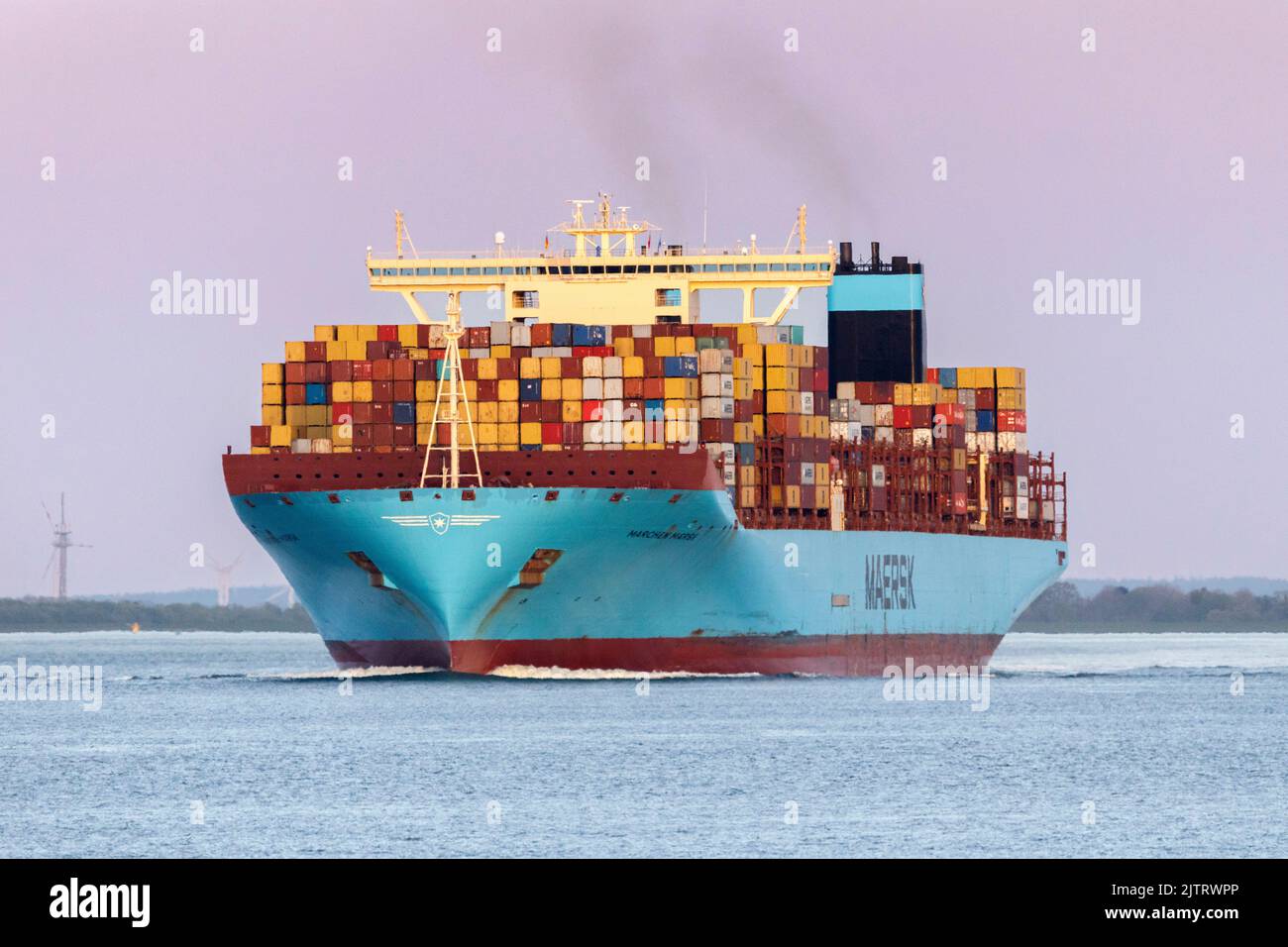 North Sea at the mouth of the Elbe in the evening, container ship ...