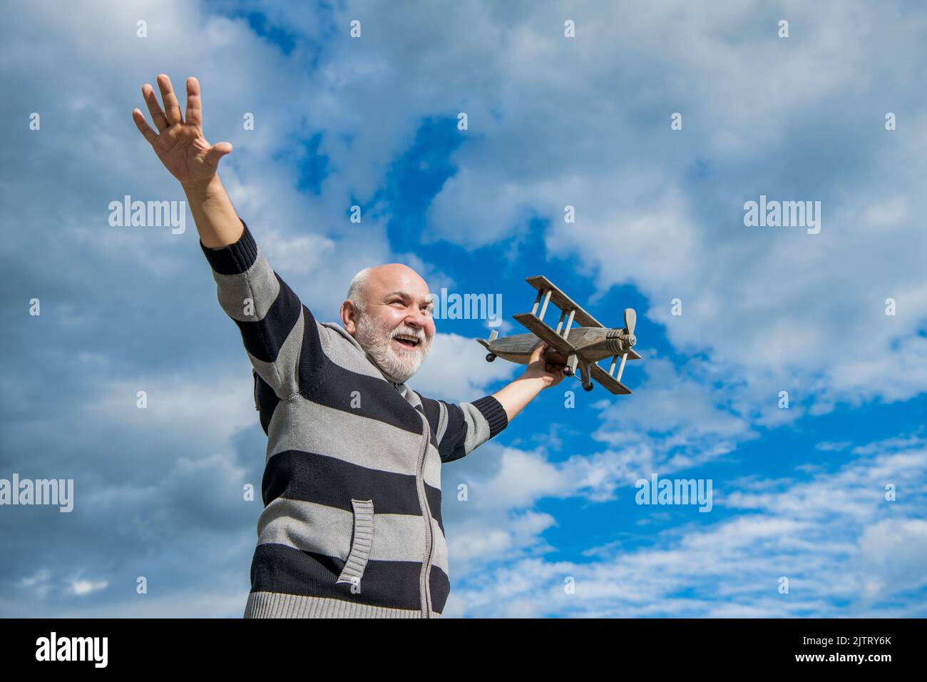 happy retirement. glad retired granddad with toy. retired old man ...