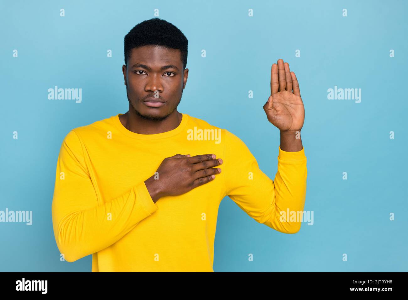 Photo of multinational guy hold hand on chest making vow military ...