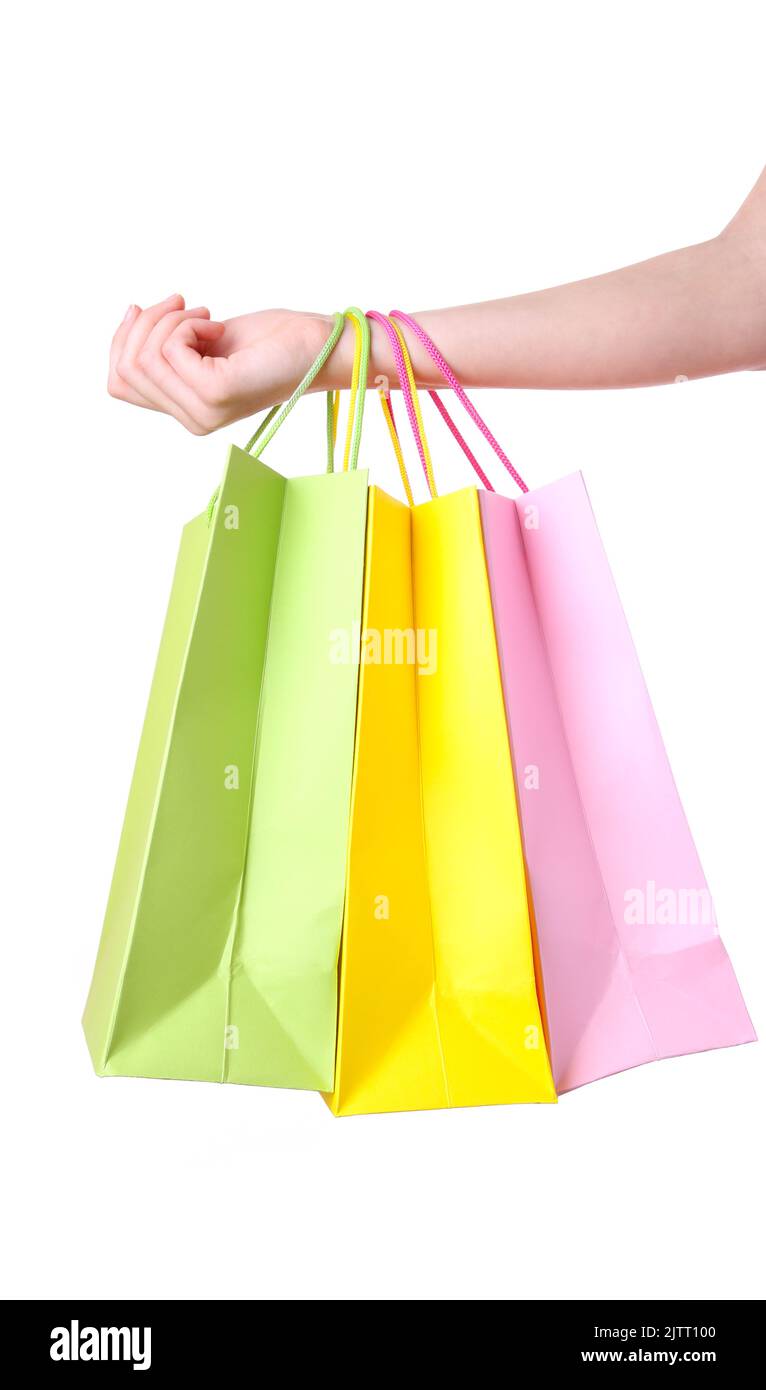 Hand holding colorful paper bags isolated on white, background shopping ...