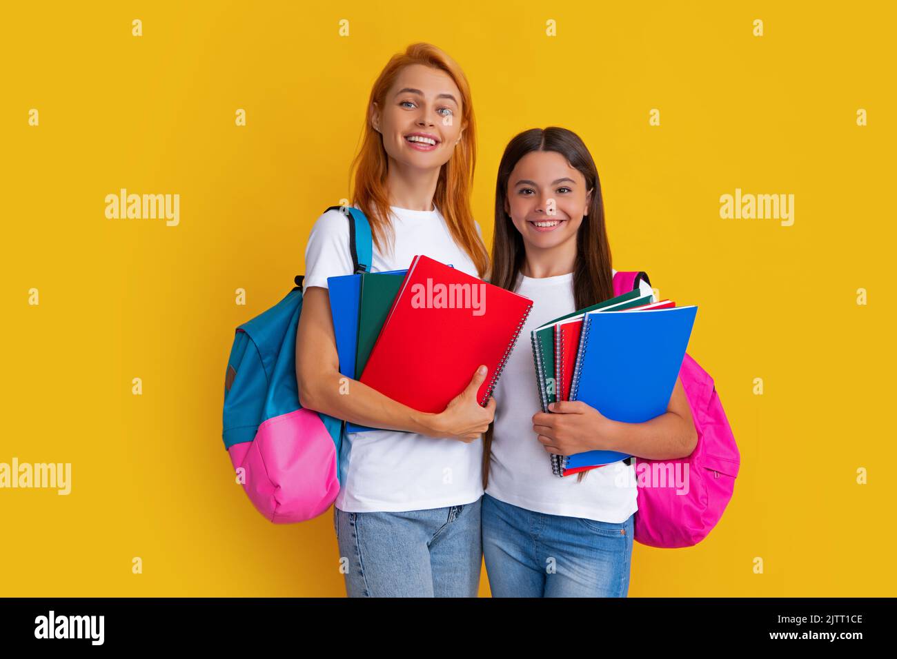 Mother and daughter schoolgirls with school bag and books ready to ...
