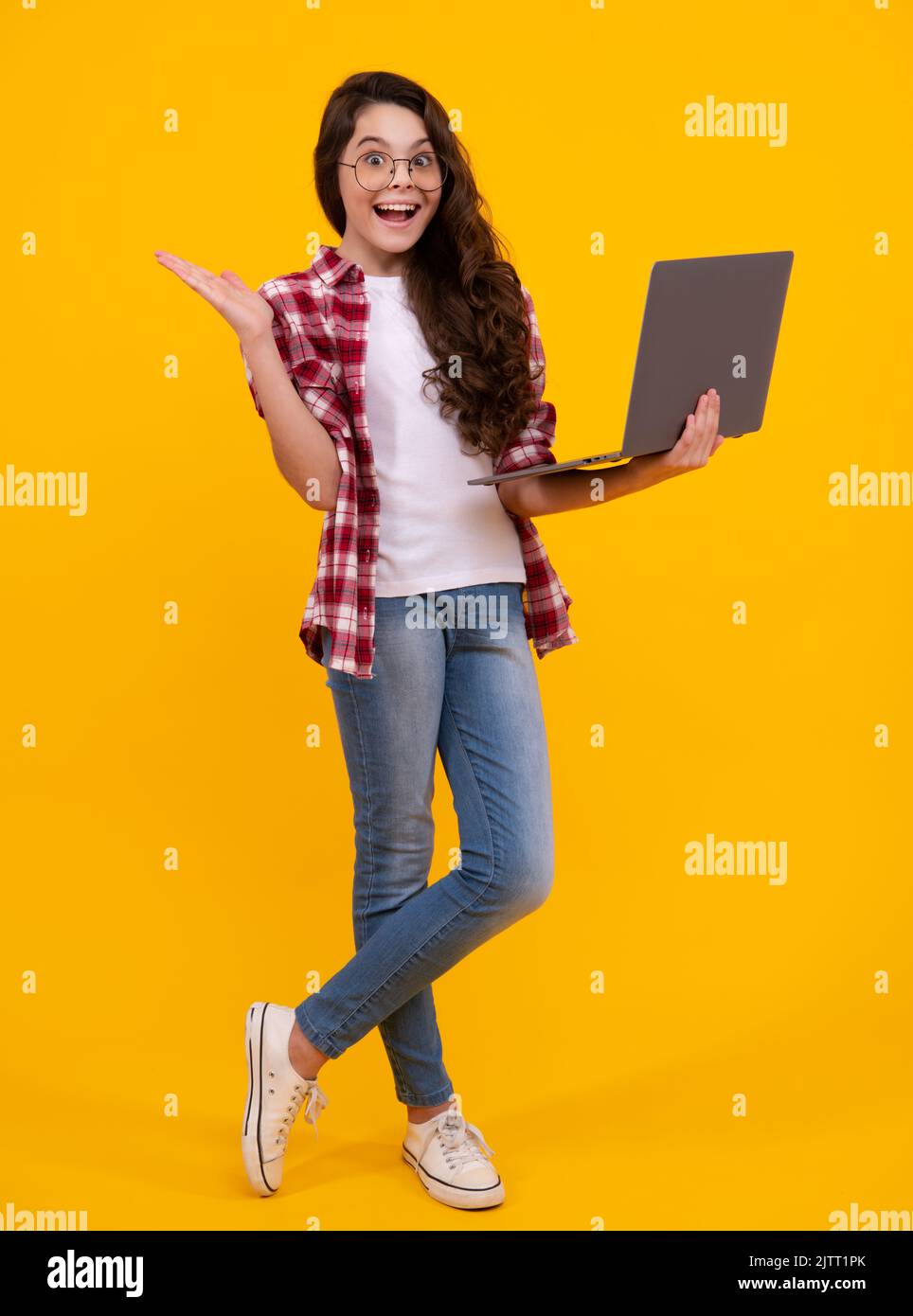Student teenager schoolgirl with laptop on isolated background. Online ...