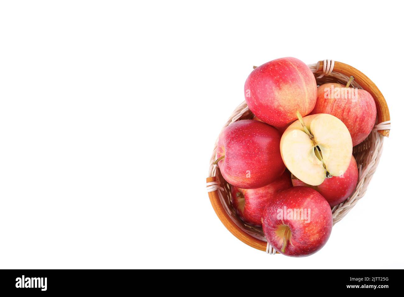 Fresh red apples in a basket, isolated on white Stock Photo - Alamy