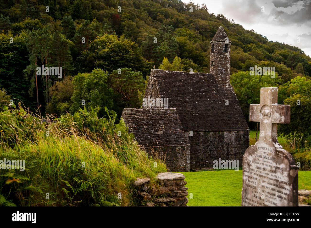 Stone roof and round tower of St. Kevins KItchen in Glendalough ...