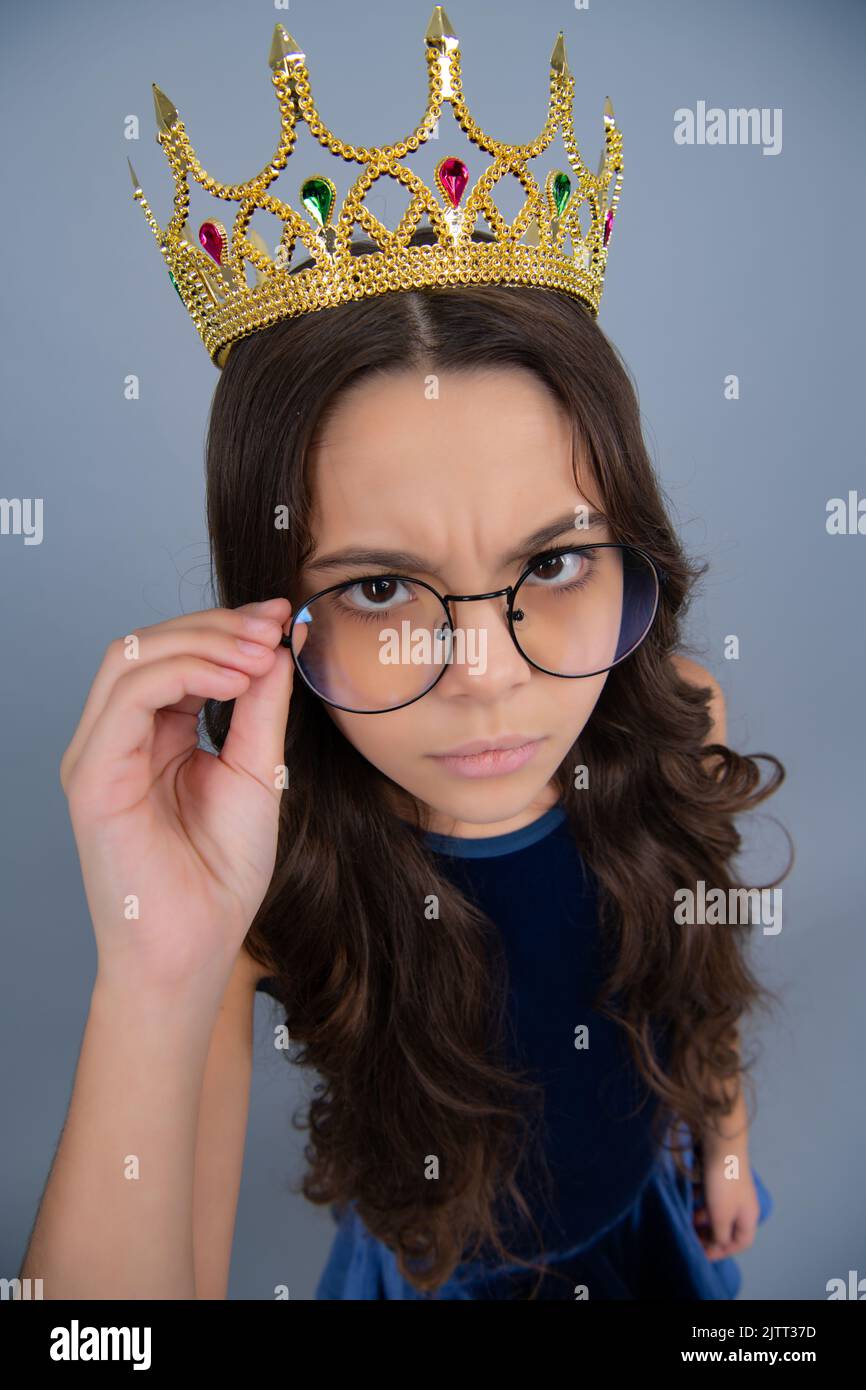 Beauty teen girl queen wear crown. Child in princess diadem. Angry teenager girl, upset and ...