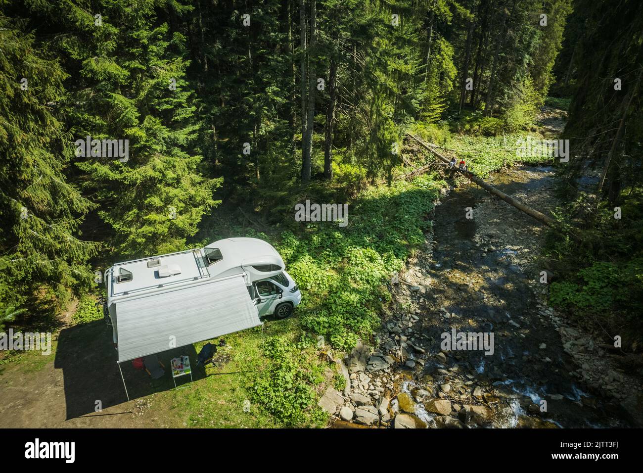 Top View of White Recreational Vehicle Parked Next to a Forest Stream ...
