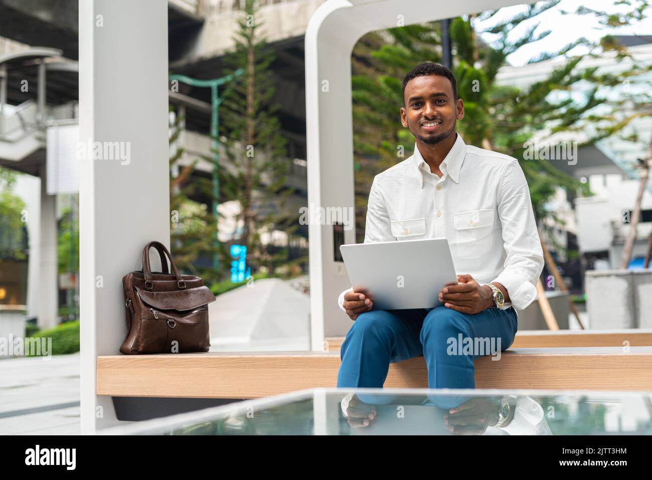 Stylish guy working laptop sitting hi-res stock photography and images ...