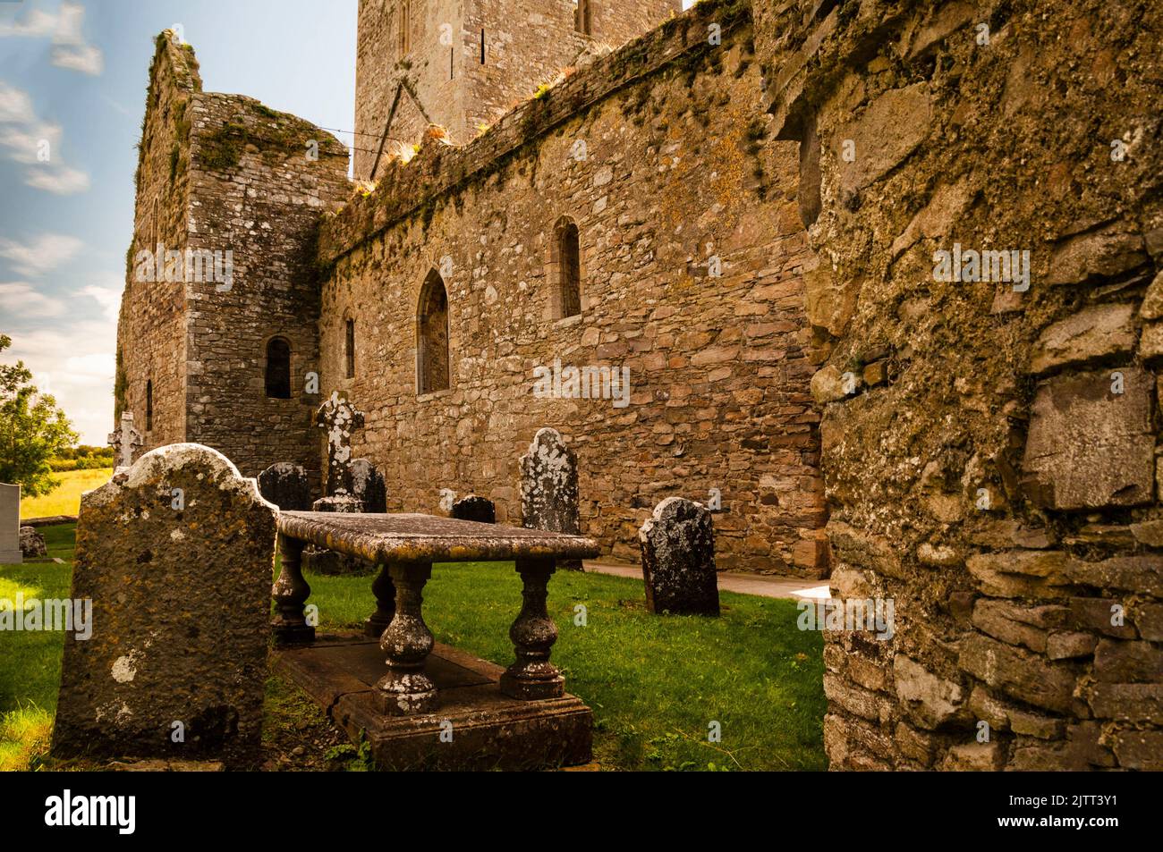 Horizontal gravestone at Jerpoint Abbey ruins and part of a square ...