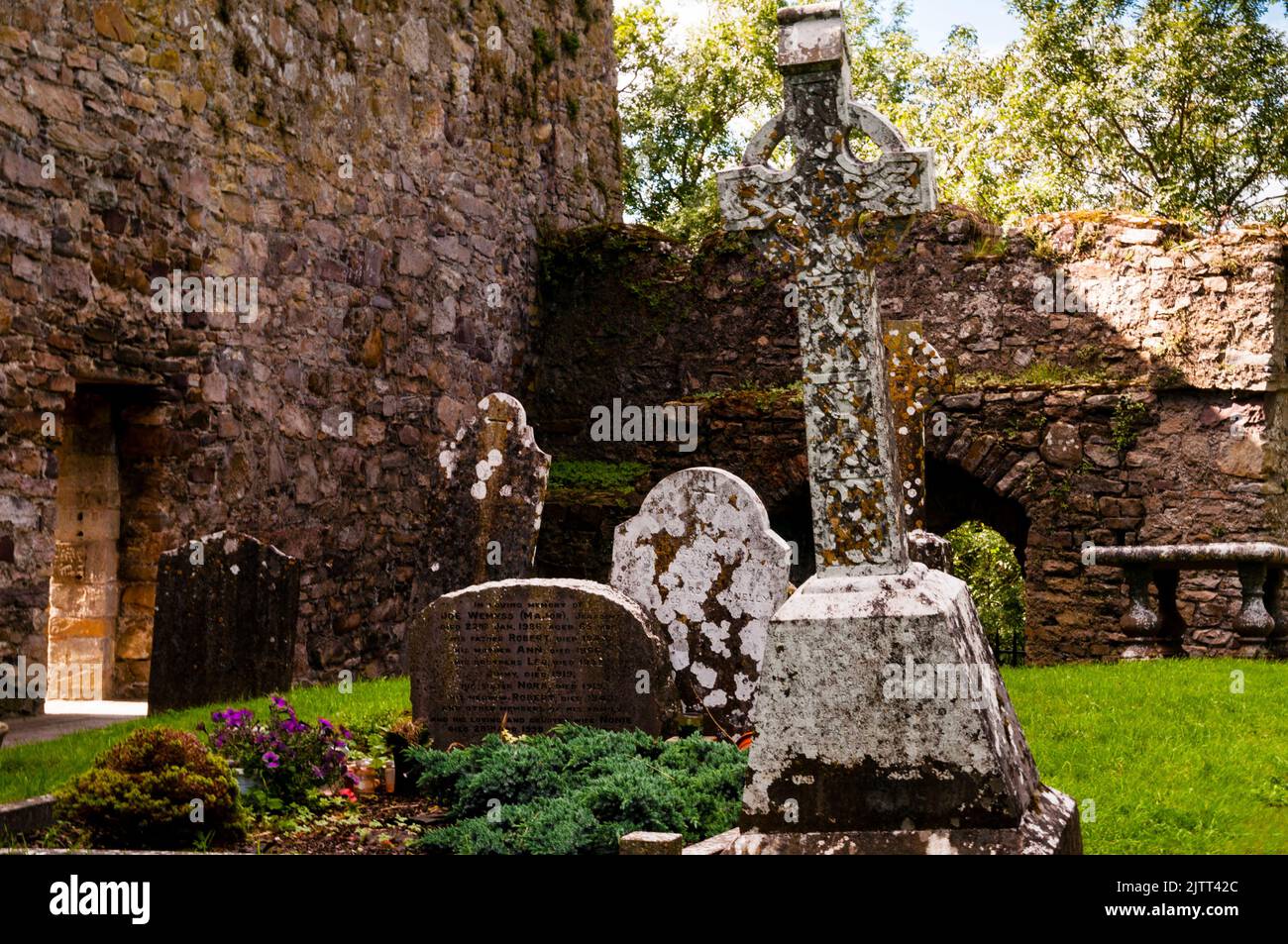 Table tomb and Celtic Cross at Jerpoint Abbey ruins in County Kilkenny ...