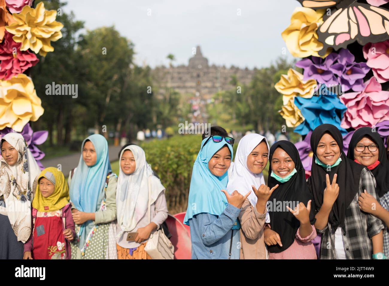 Tourist school girls pose for a photograph outside the ancient Buddhist ...
