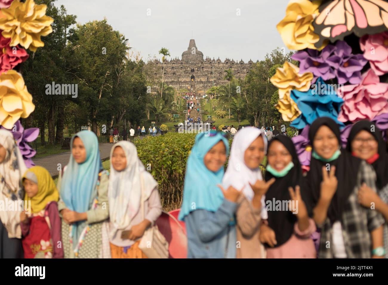 Tourist school girls pose for a photograph outside the ancient Buddhist ...