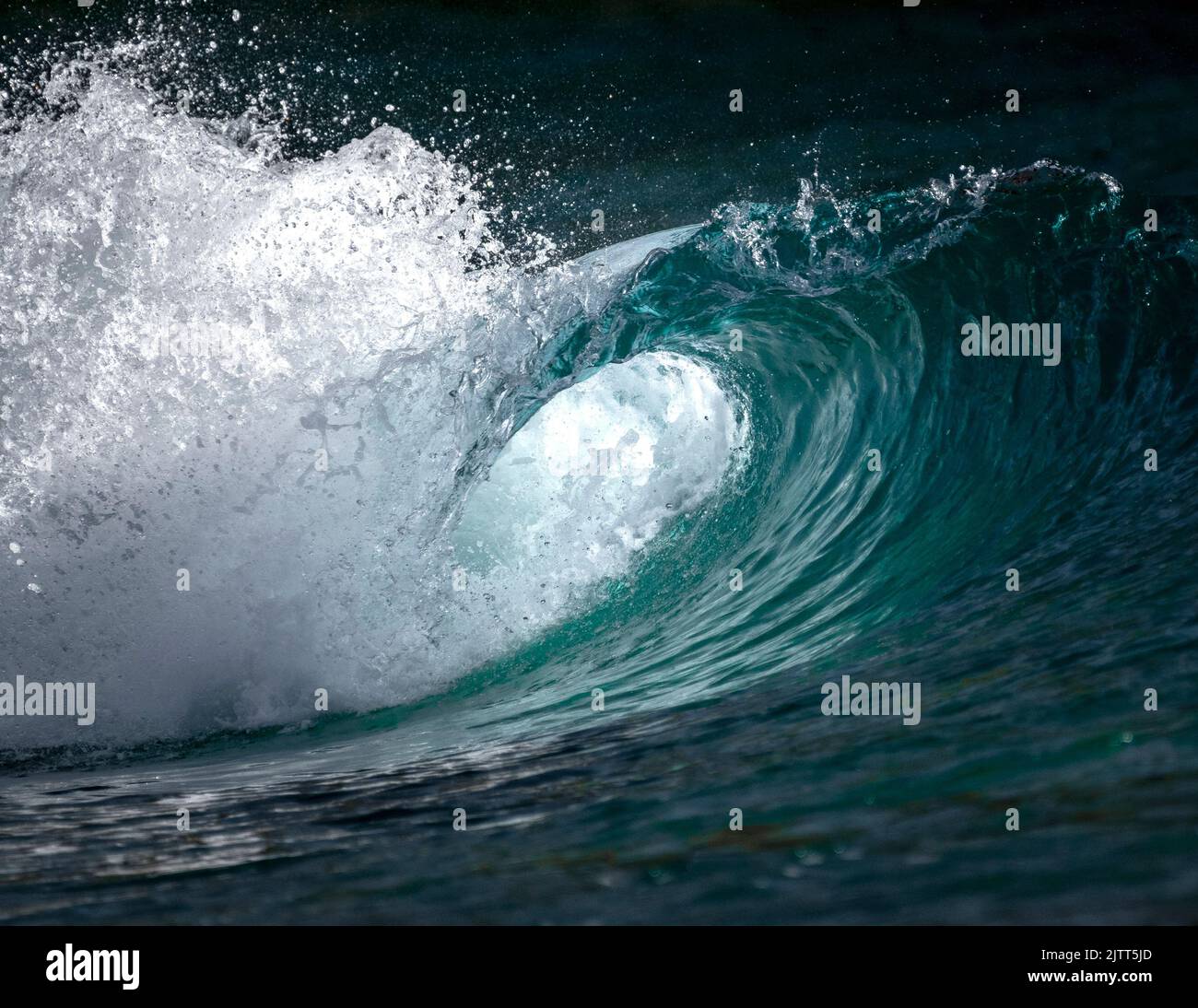 Beautiful turquoise wave rolling in at Kynance cove Cornwall Stock ...
