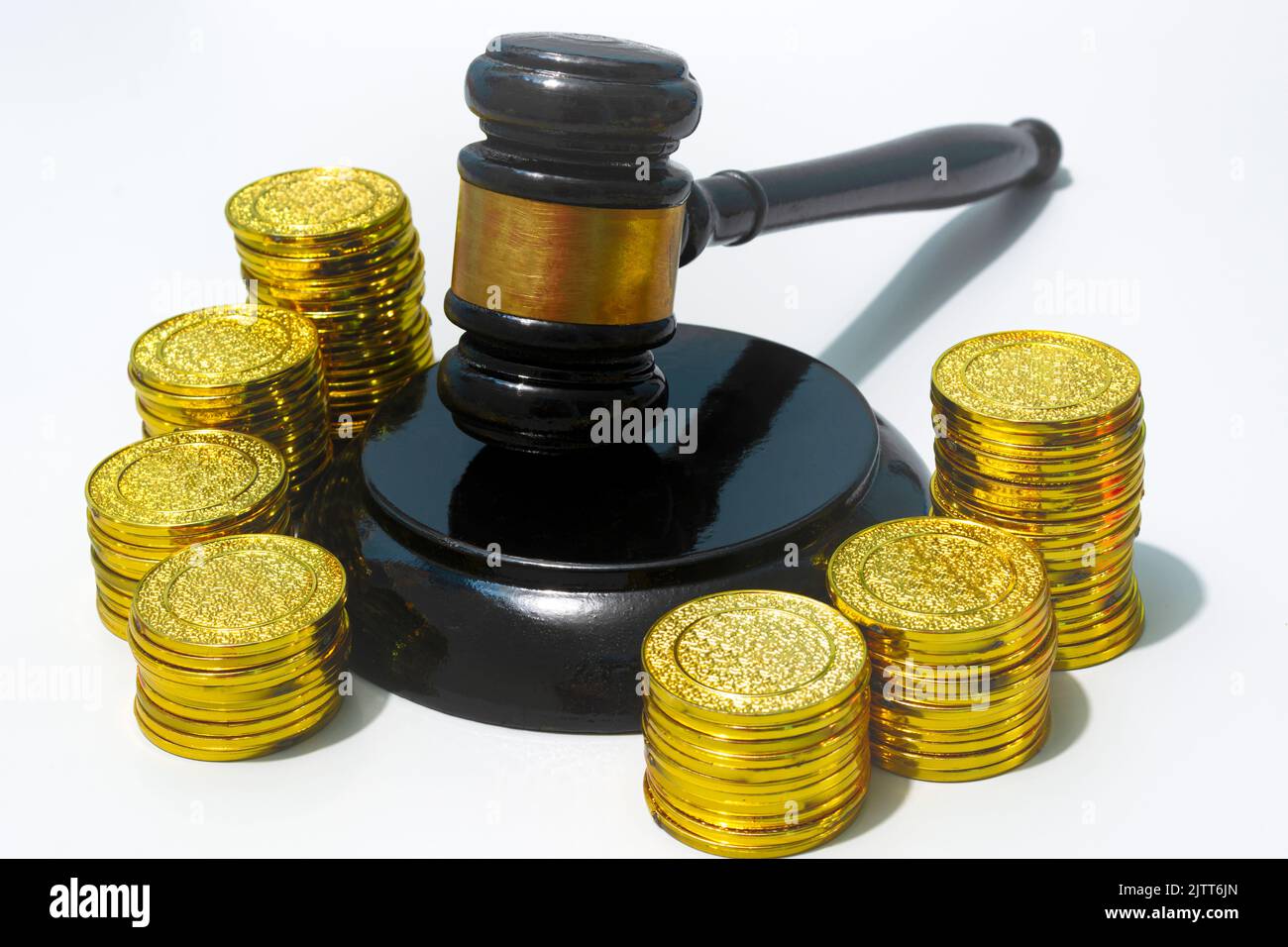 Judge gavel with pile of gold coins on white background Stock Photo - Alamy