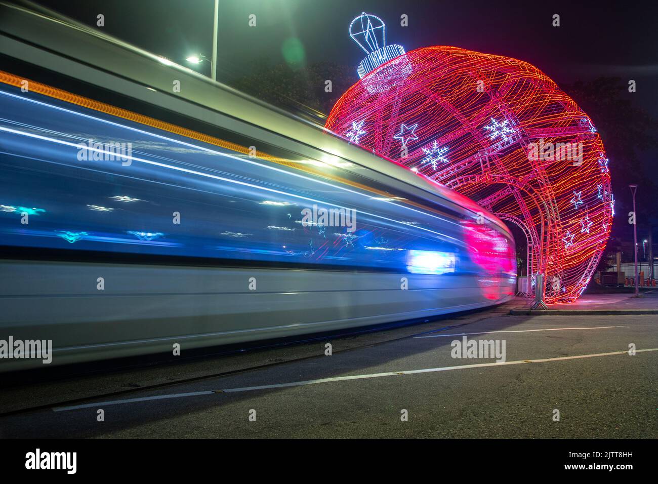 VLT train passing through the Christmas decoration of the Rio de ...