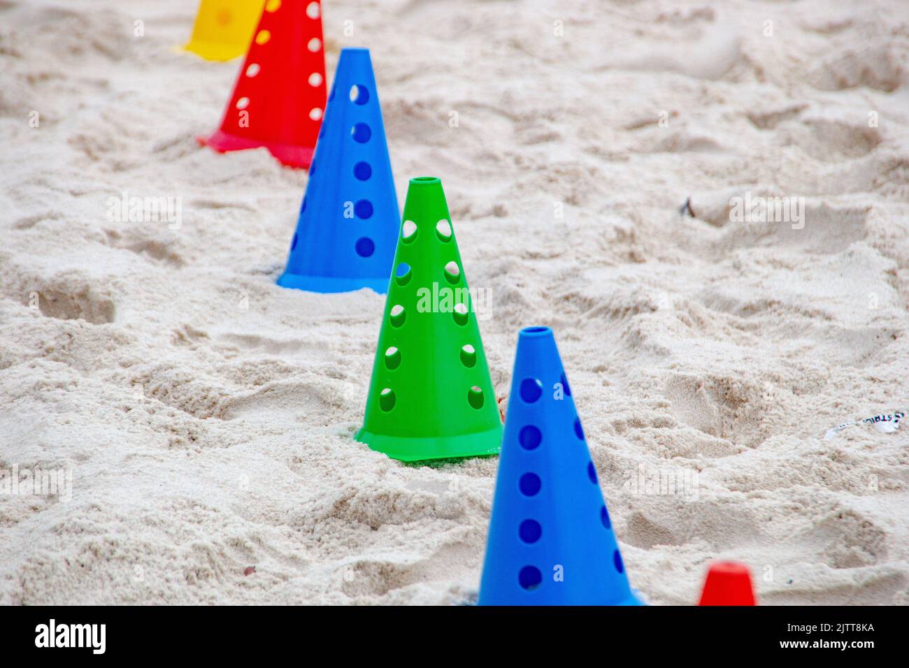colorful icons used to practice functional exercises on the beach, a ...