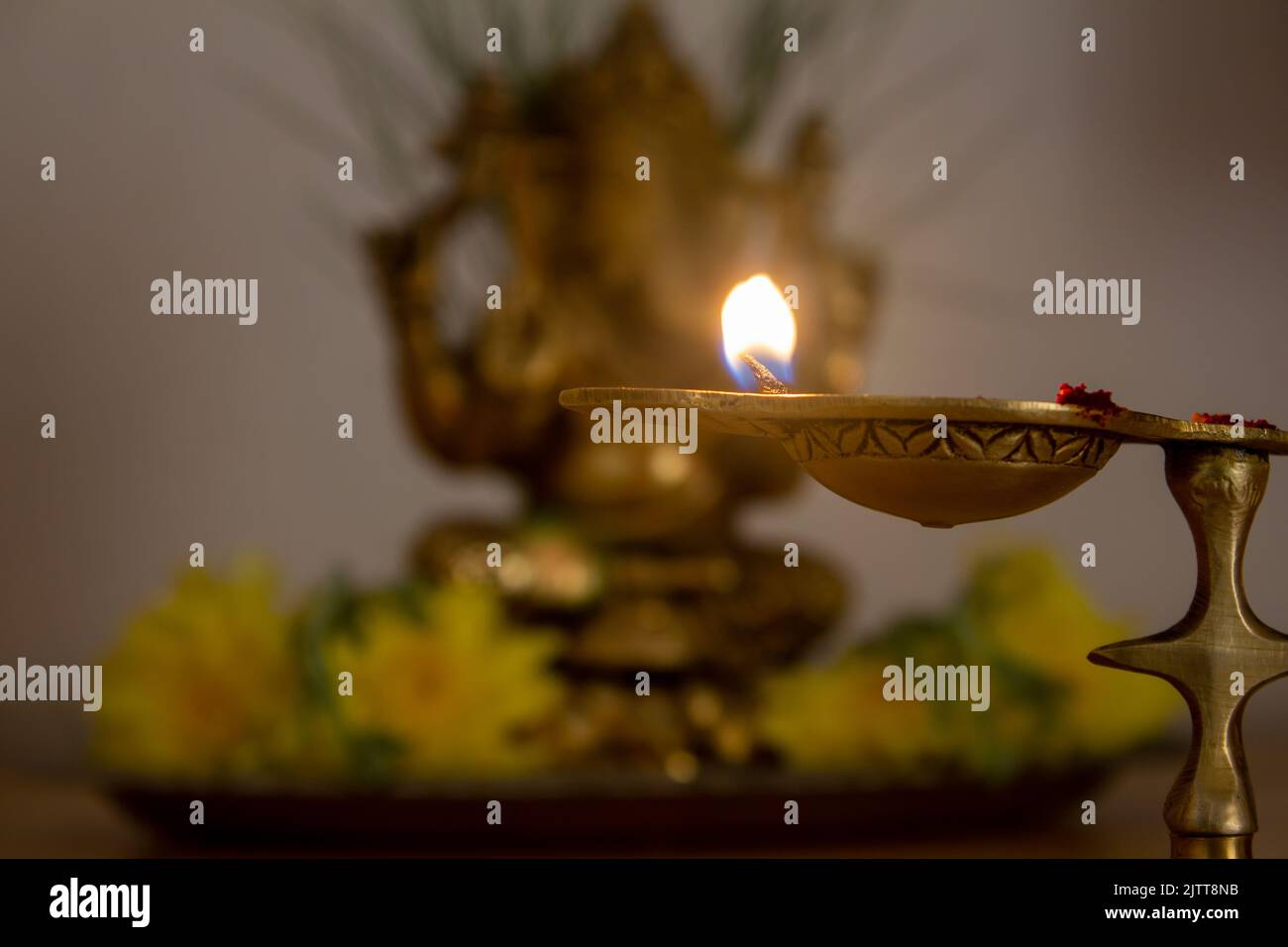 Lit lamp before god during Indian festival. Traditional way of lamps ...