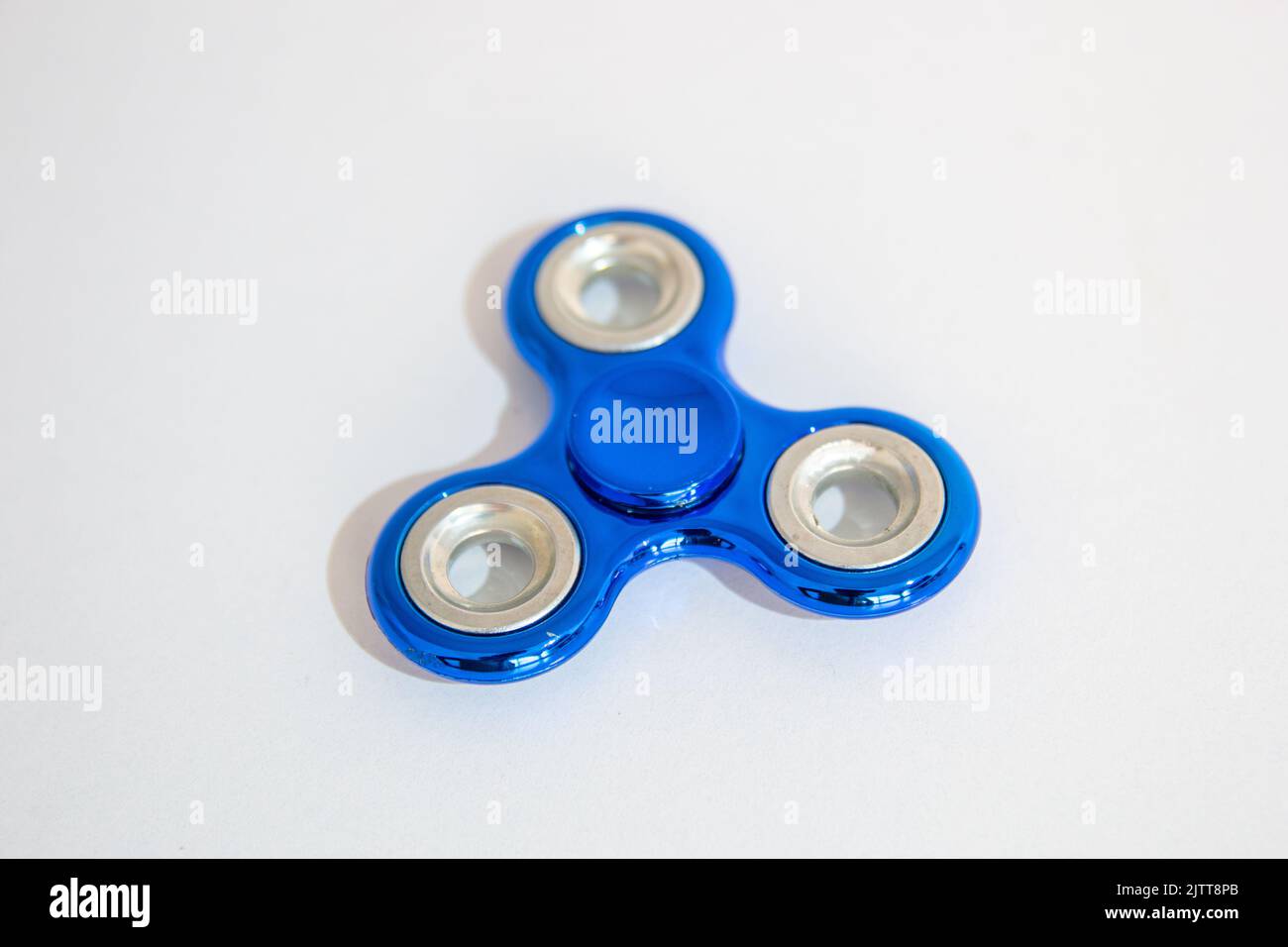 hand toy known as hand spinner in blue color, very popular in brazil ...