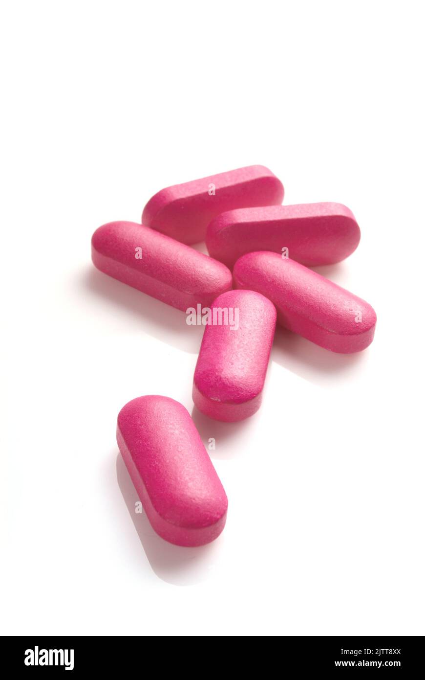 Pink ibuprofen pills on white hi-res stock photography and images - Alamy