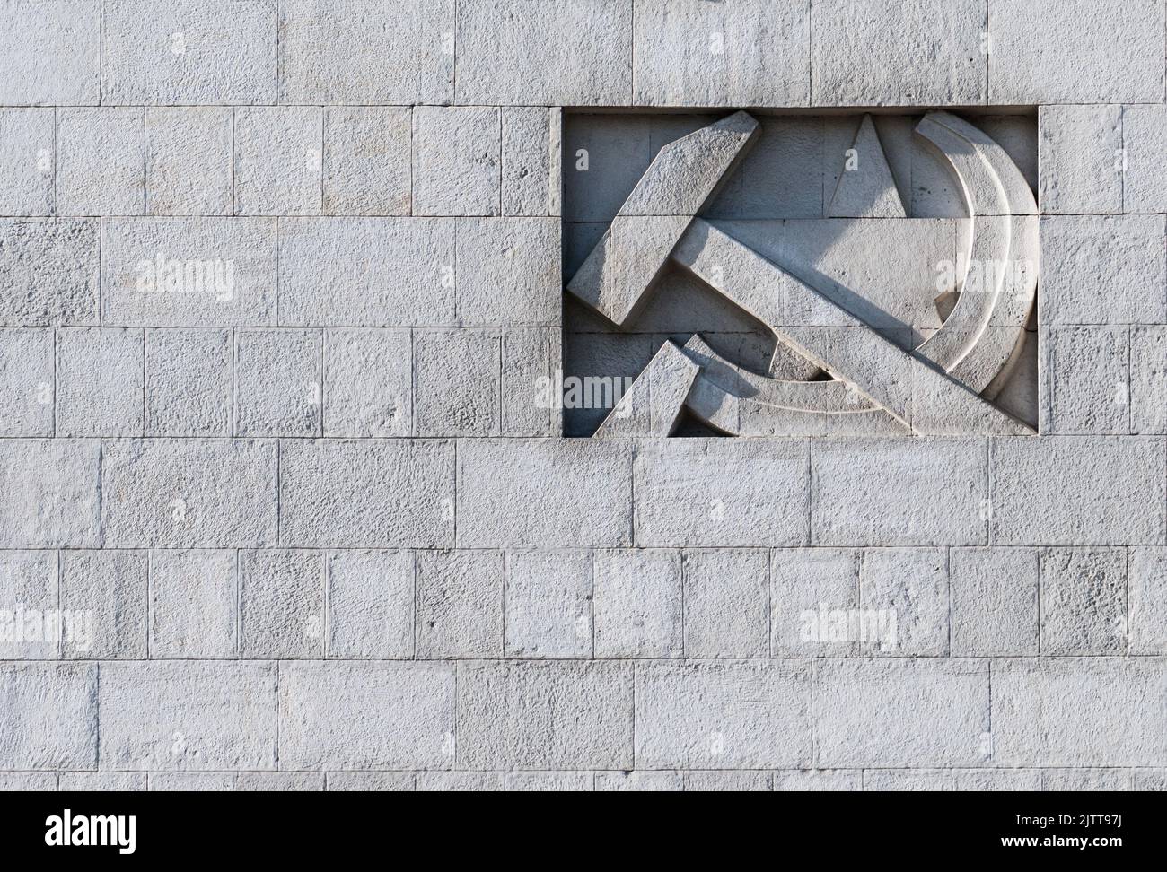 Symbols of USSR on gray brick wall of soviet era building Stock Photo ...