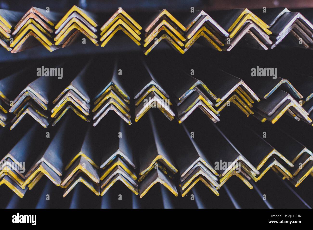 A frontal view of stainless steel angle bar rows Stock Photo - Alamy