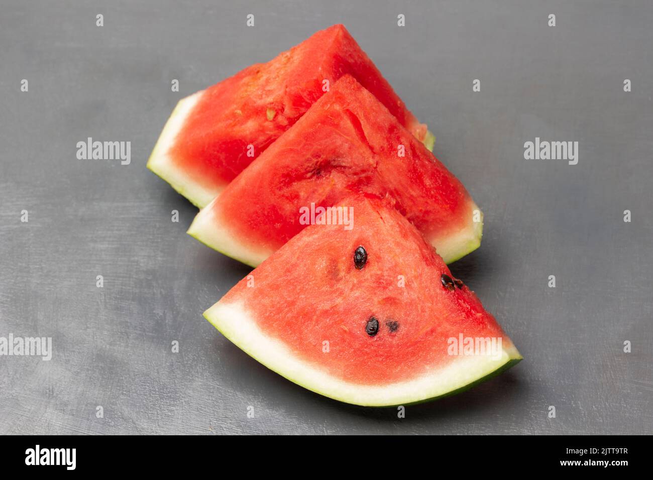 Three pieces of watermelon, part of the frame. Copy space. Top view ...