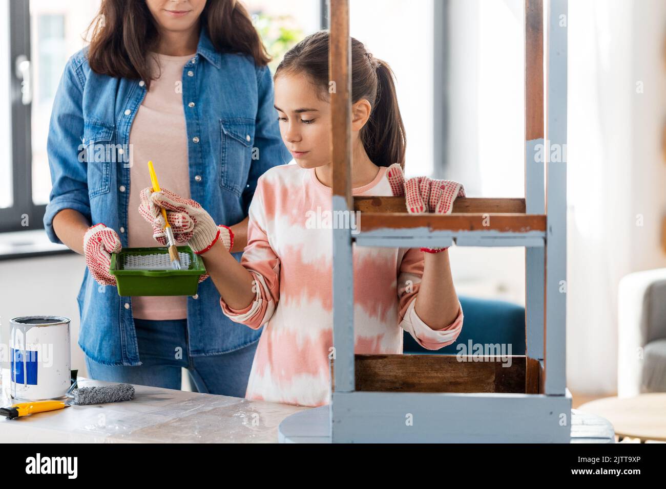 mother and daughter painting old table at home Stock Photo - Alamy